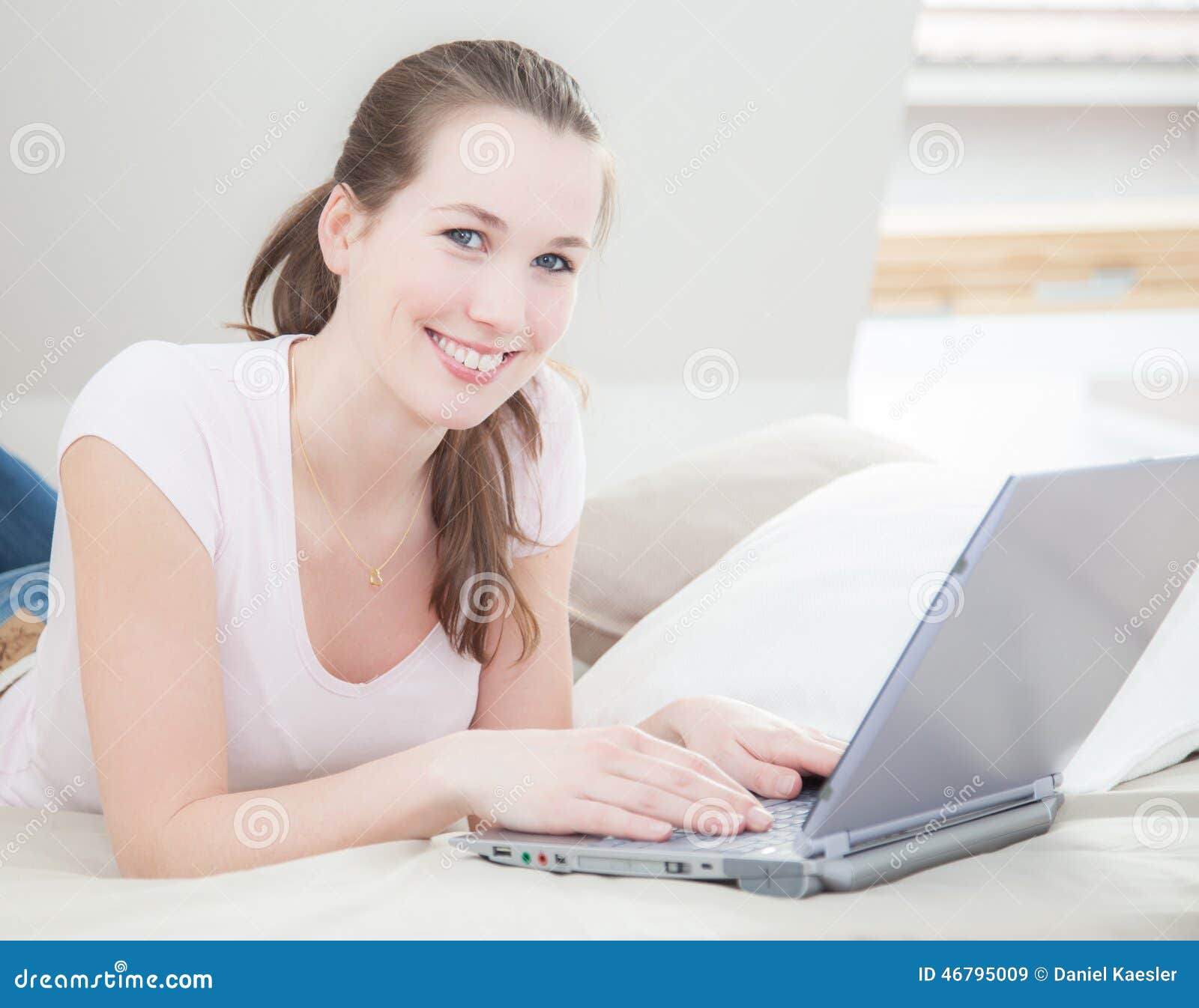 Woman using laptop at home stock image. Image of login - 46795009