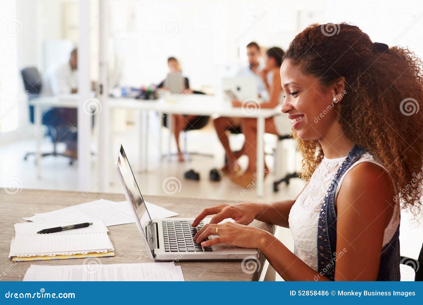 Woman Using Laptop in Modern Office of Start Up Business Stock Photo ...
