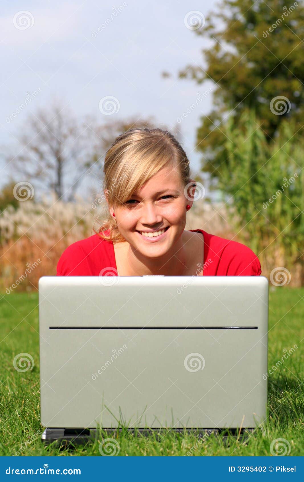 Woman Using Laptop Outdoors Stock Photo - Image of casual, field: 3295402