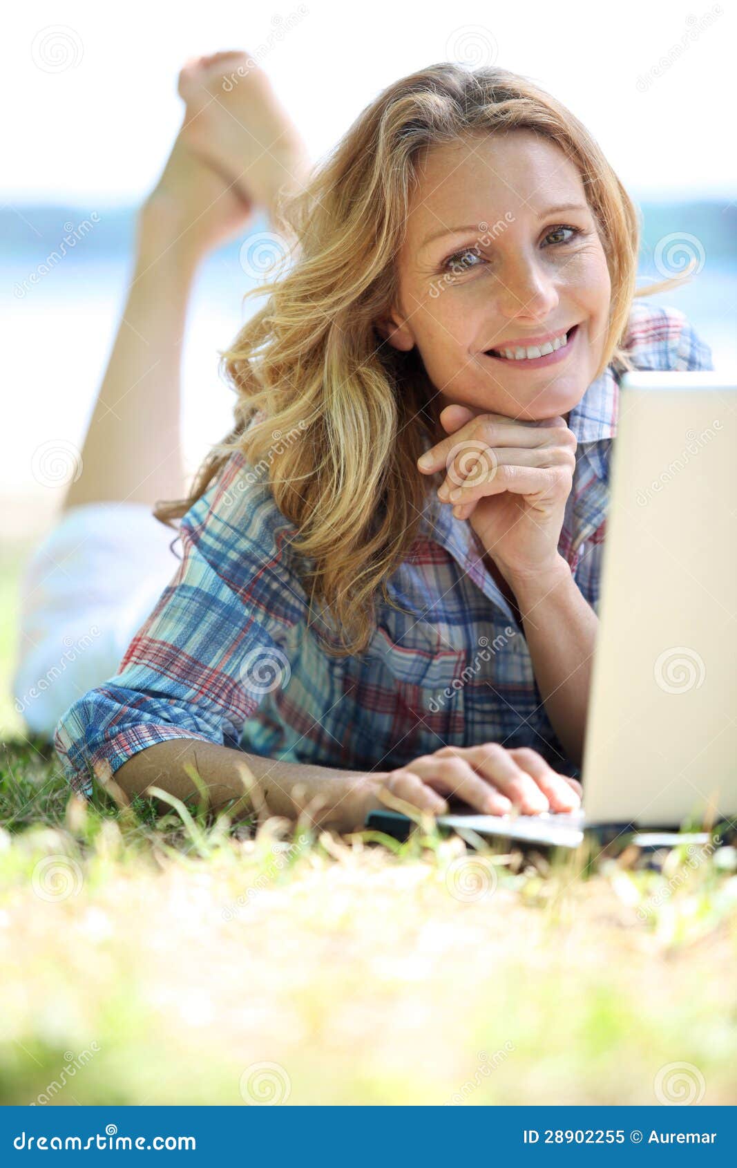 Woman using laptop outside stock image. Image of blonde - 28902255