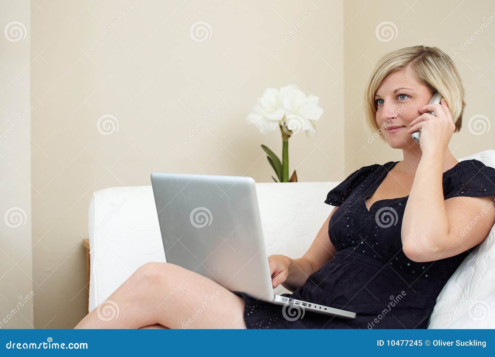Woman Using Laptop and Phone Stock Image - Image of laptop, home: 10477245