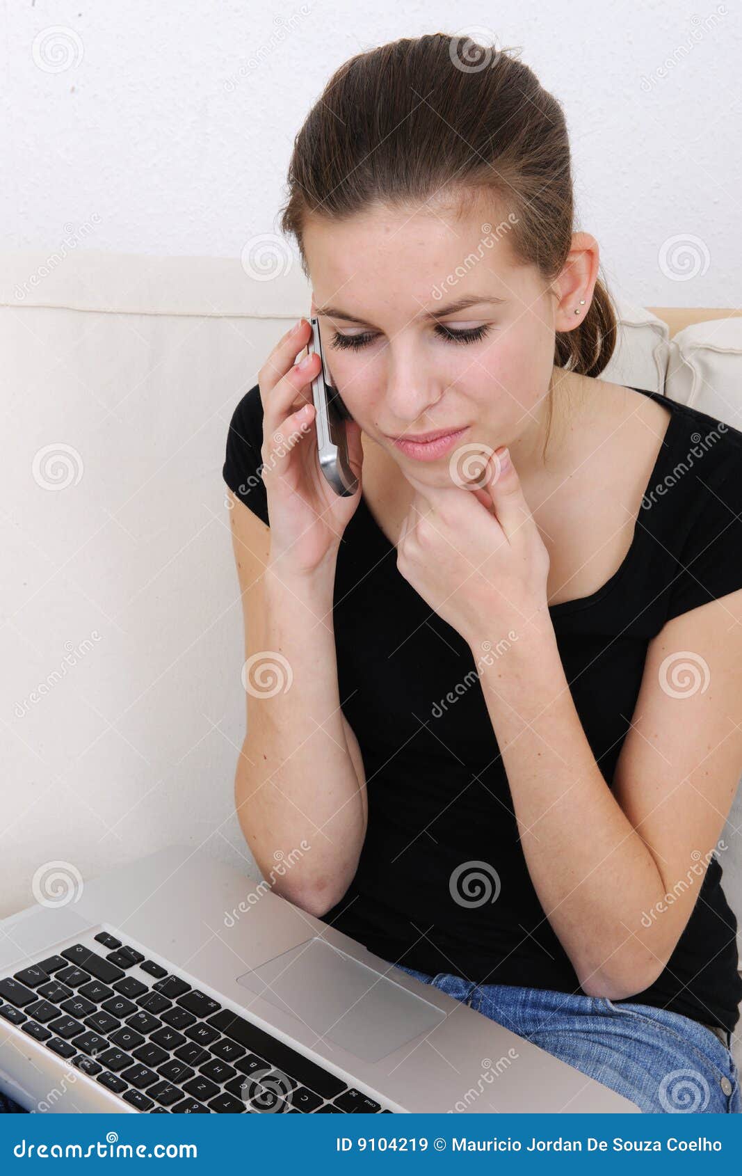 Woman Using a Laptop and Talking on Phone Stock Image - Image of mobile ...