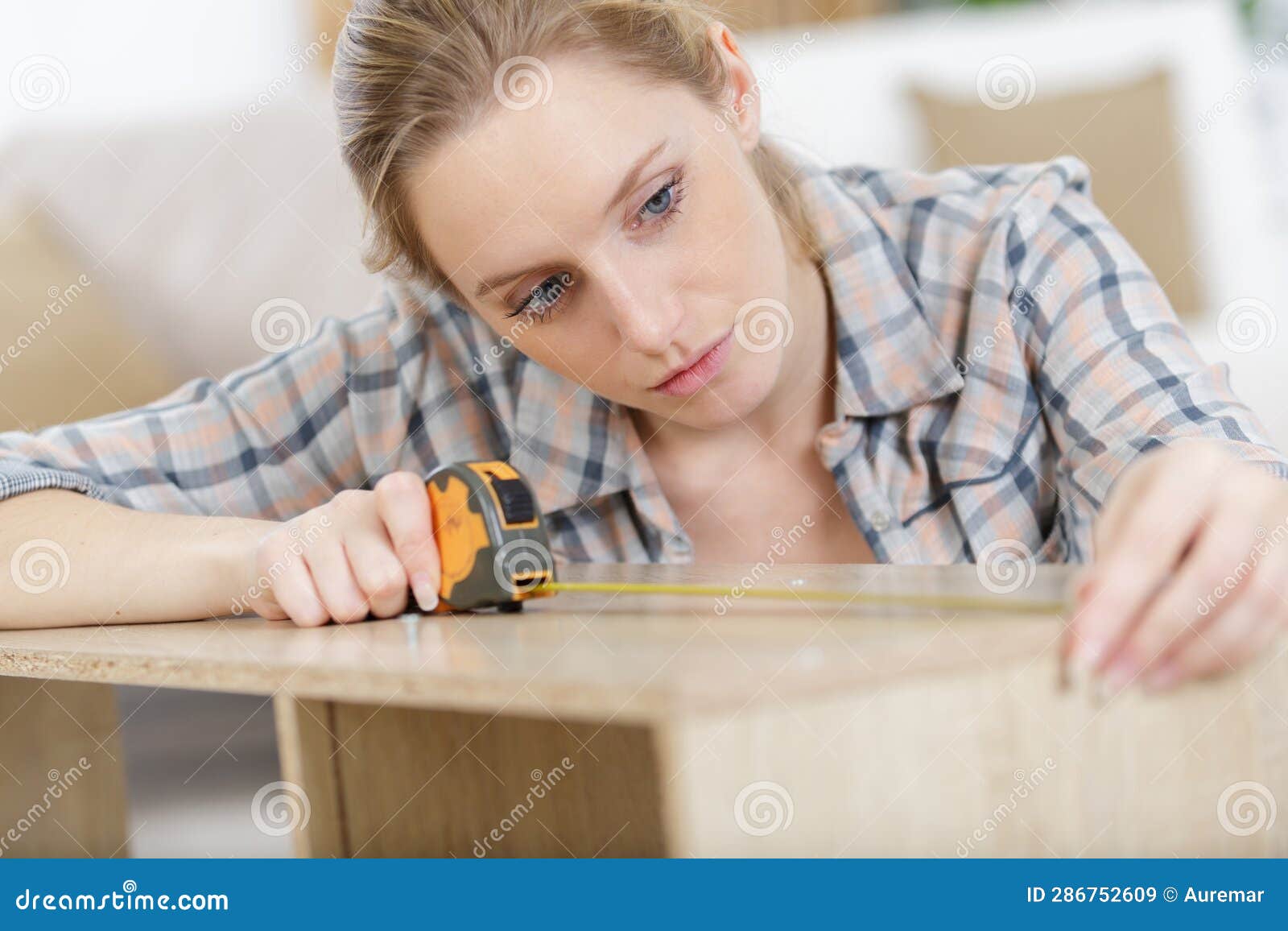 Woman using measuring tape stock image. Image of accuracy - 286752609