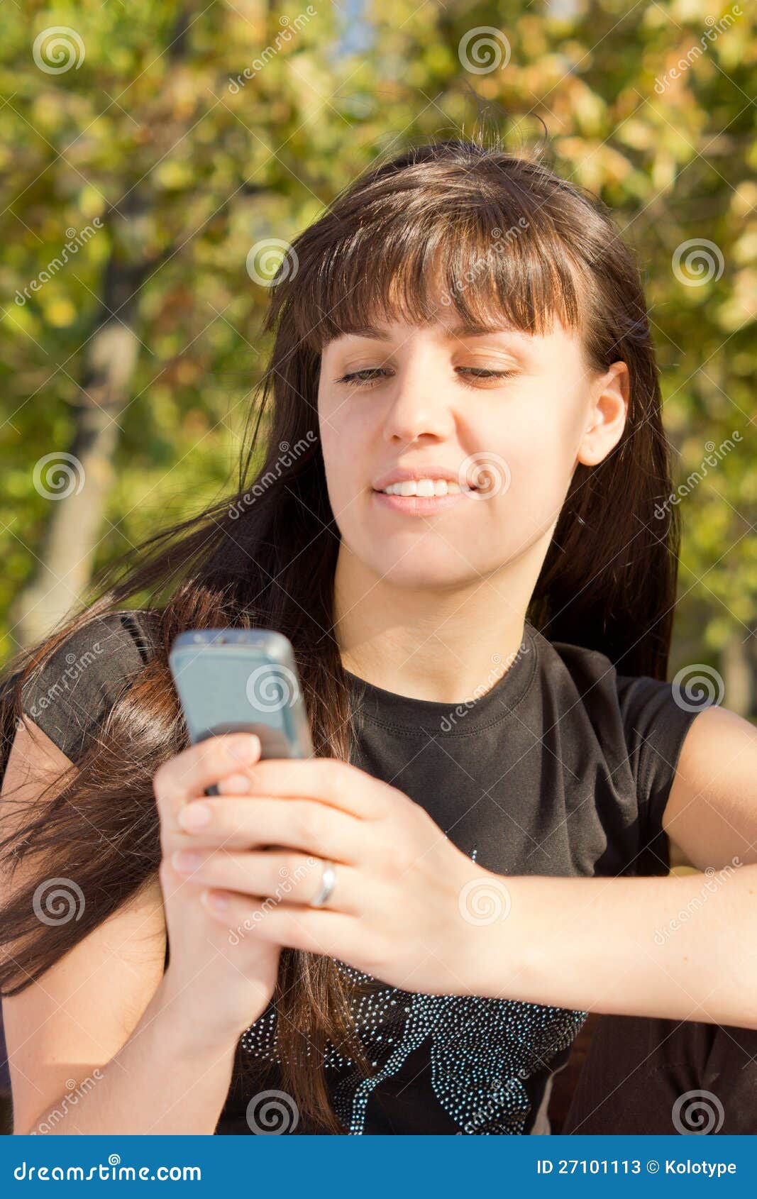Woman using mobile phone stock image. Image of outdoors - 27101113