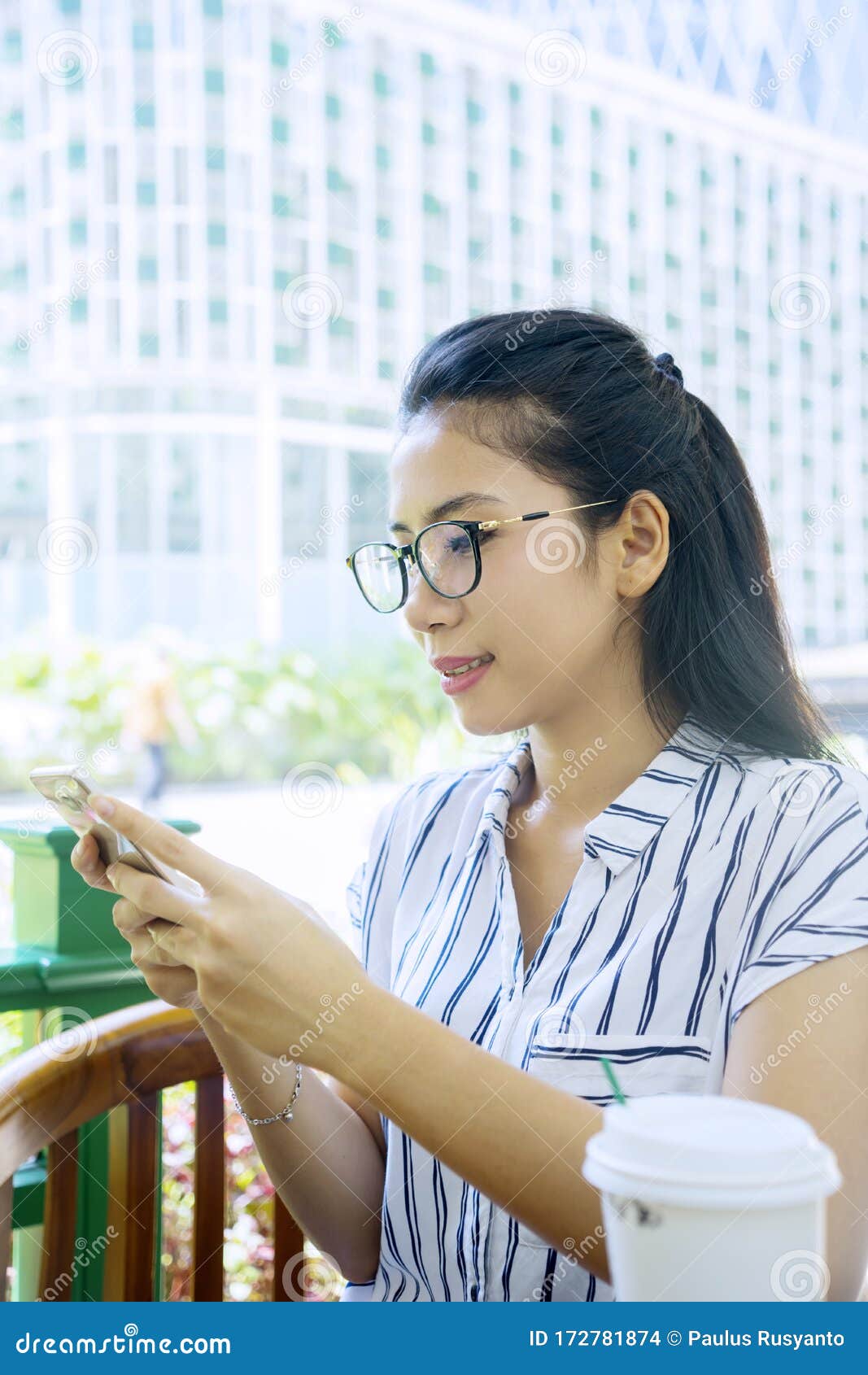 Woman Using a Mobile Phone in the Cafeteria Stock Photo - Image of ...