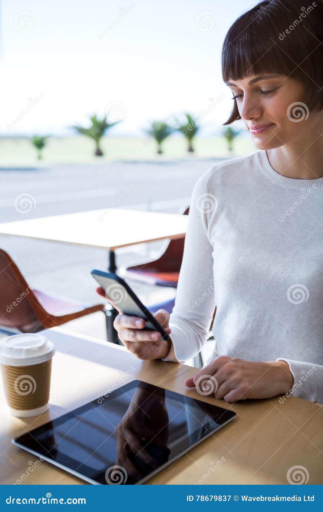 Woman Using Mobile Phone in Cafeteria Stock Image - Image of coffee ...