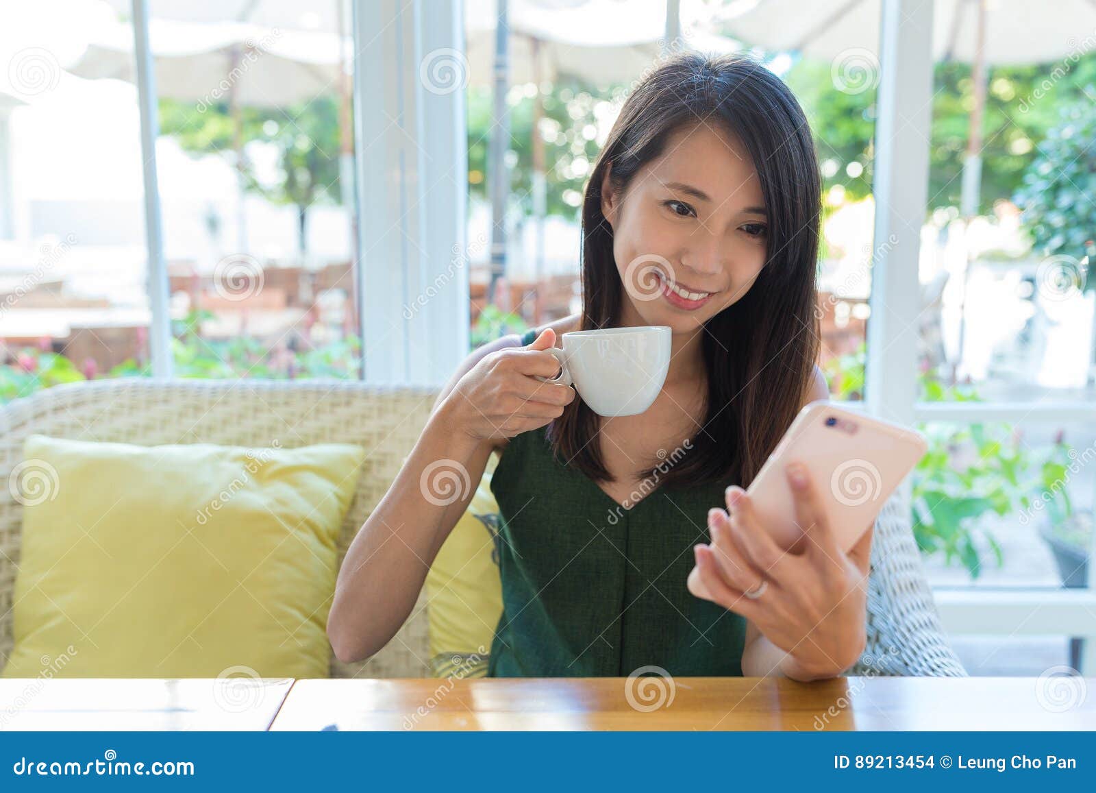 Woman Using Mobile Phone in Coffee Shop Stock Photo - Image of enjoy ...
