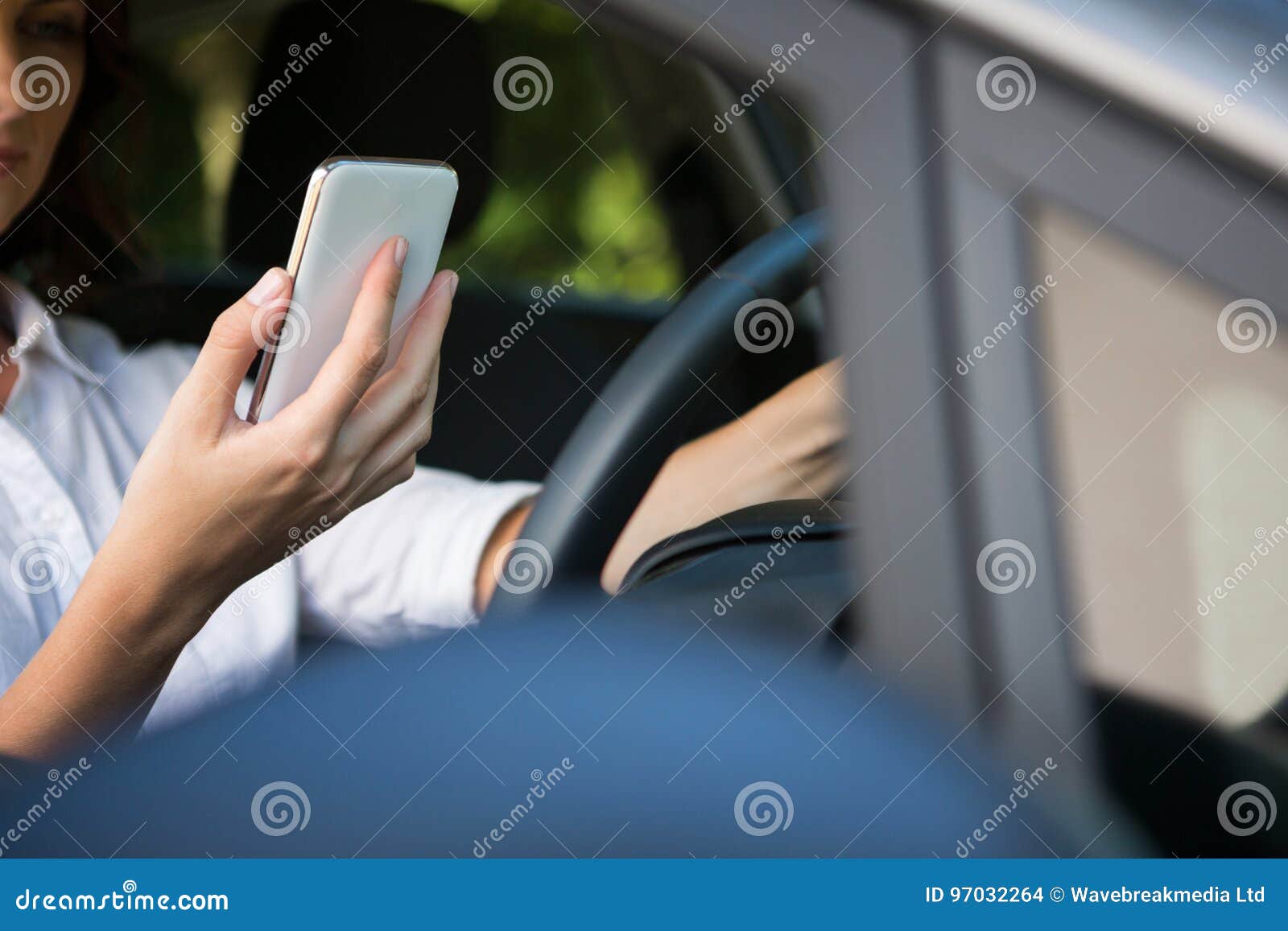 Woman Using Mobile Phone while Driving a Car Stock Photo - Image of ...