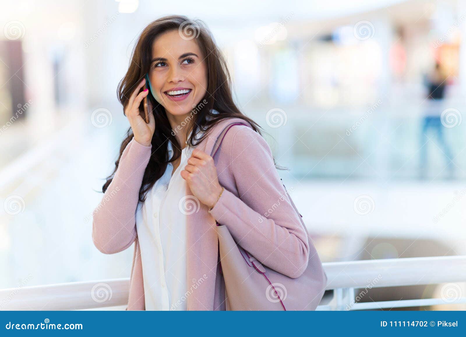 Woman Using Mobile Phone in Shopping Mall Stock Photo - Image of ...