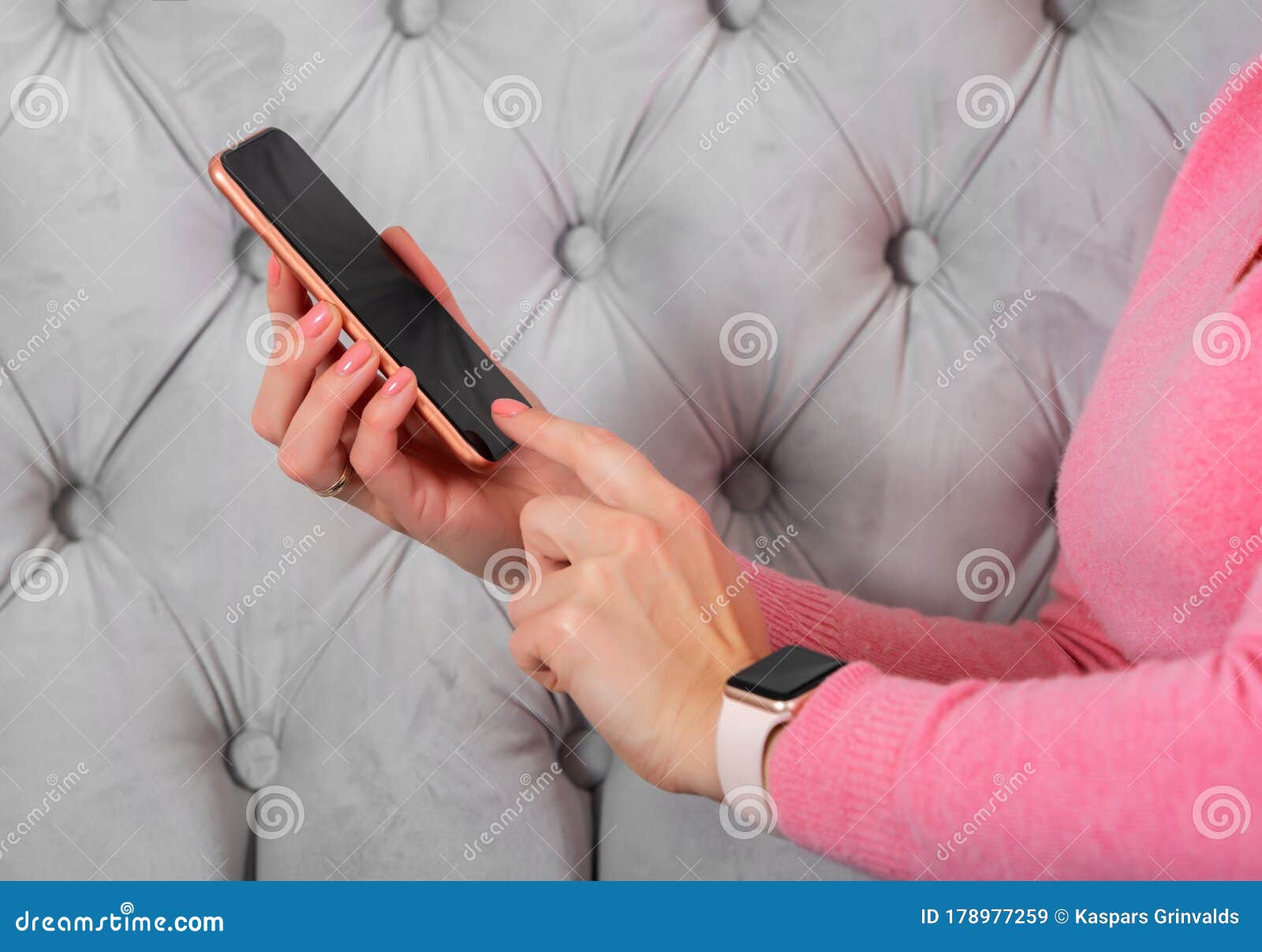 Woman Using Mobile Phone and Touching Something on the Screen Stock ...