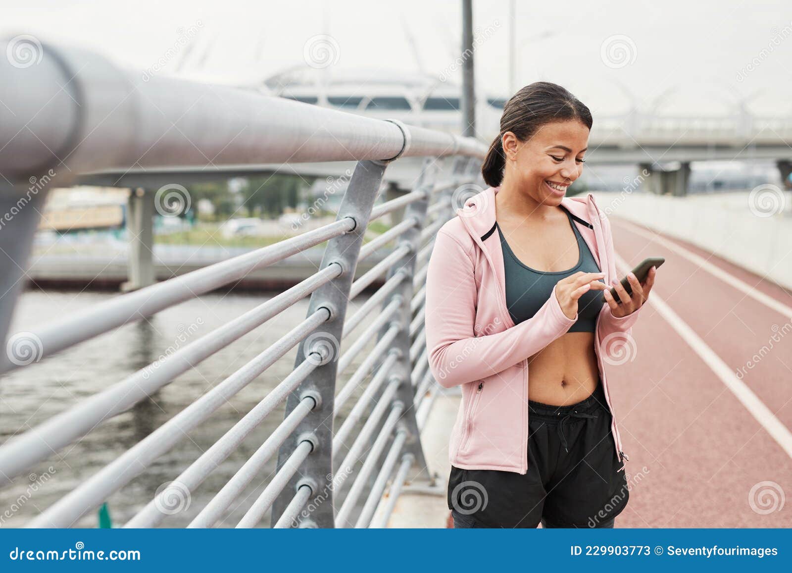 Woman Using Mobile Phone during Training Stock Image - Image of ...