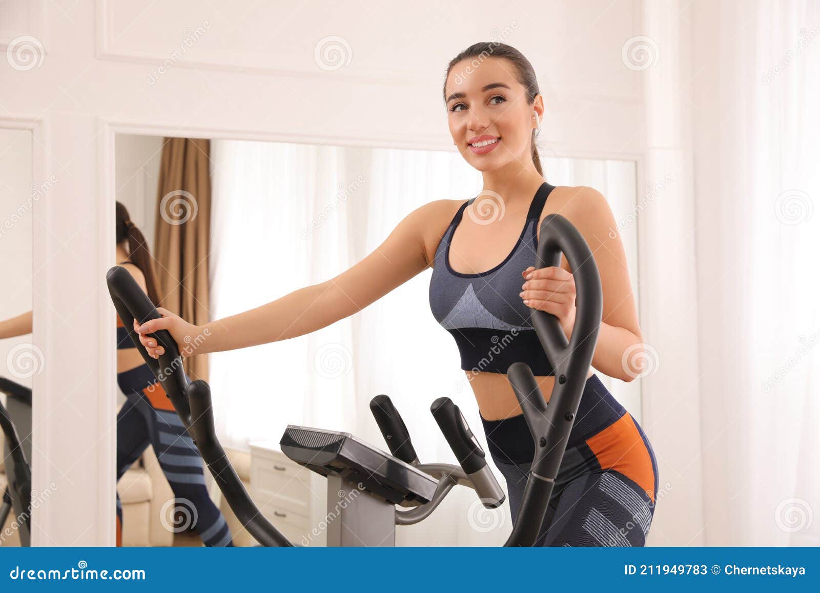 Woman Using Modern Elliptical Machine at Home Stock Image - Image of ...