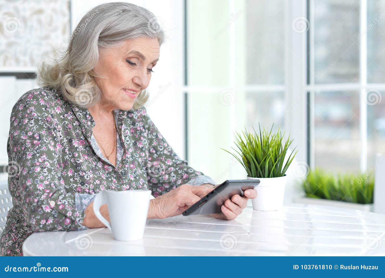 Woman using modern tablet stock photo. Image of retired - 103761810