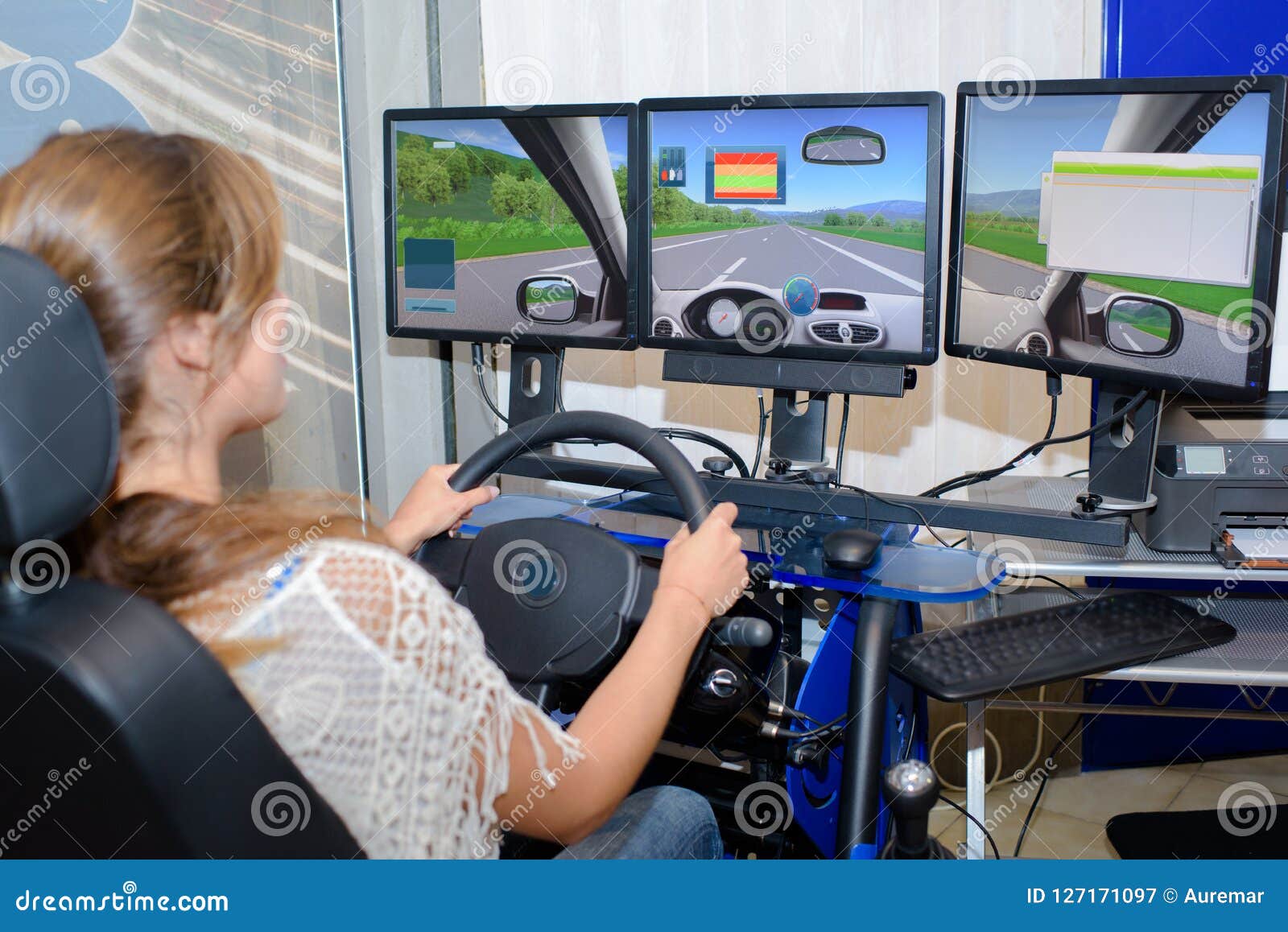 Woman Using Multi Screened Driving Simulator Stock Image - Image of ...