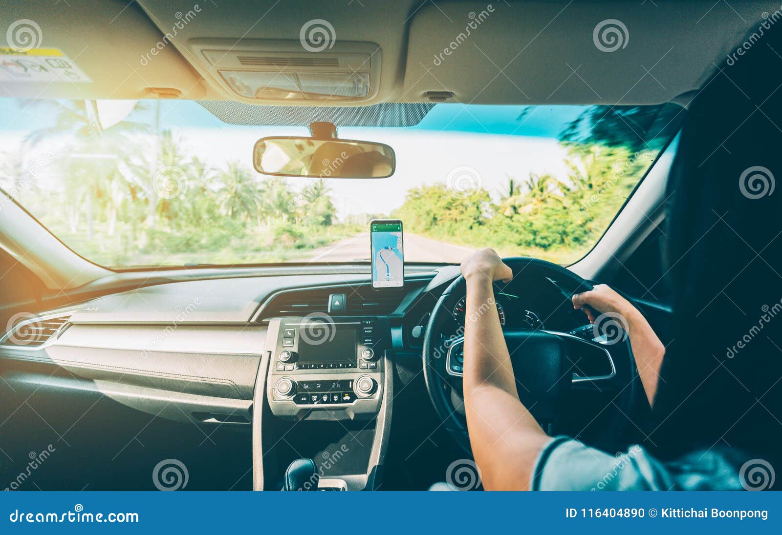 Woman Using Navigation App on Smartphone while Driving a Car Stock ...