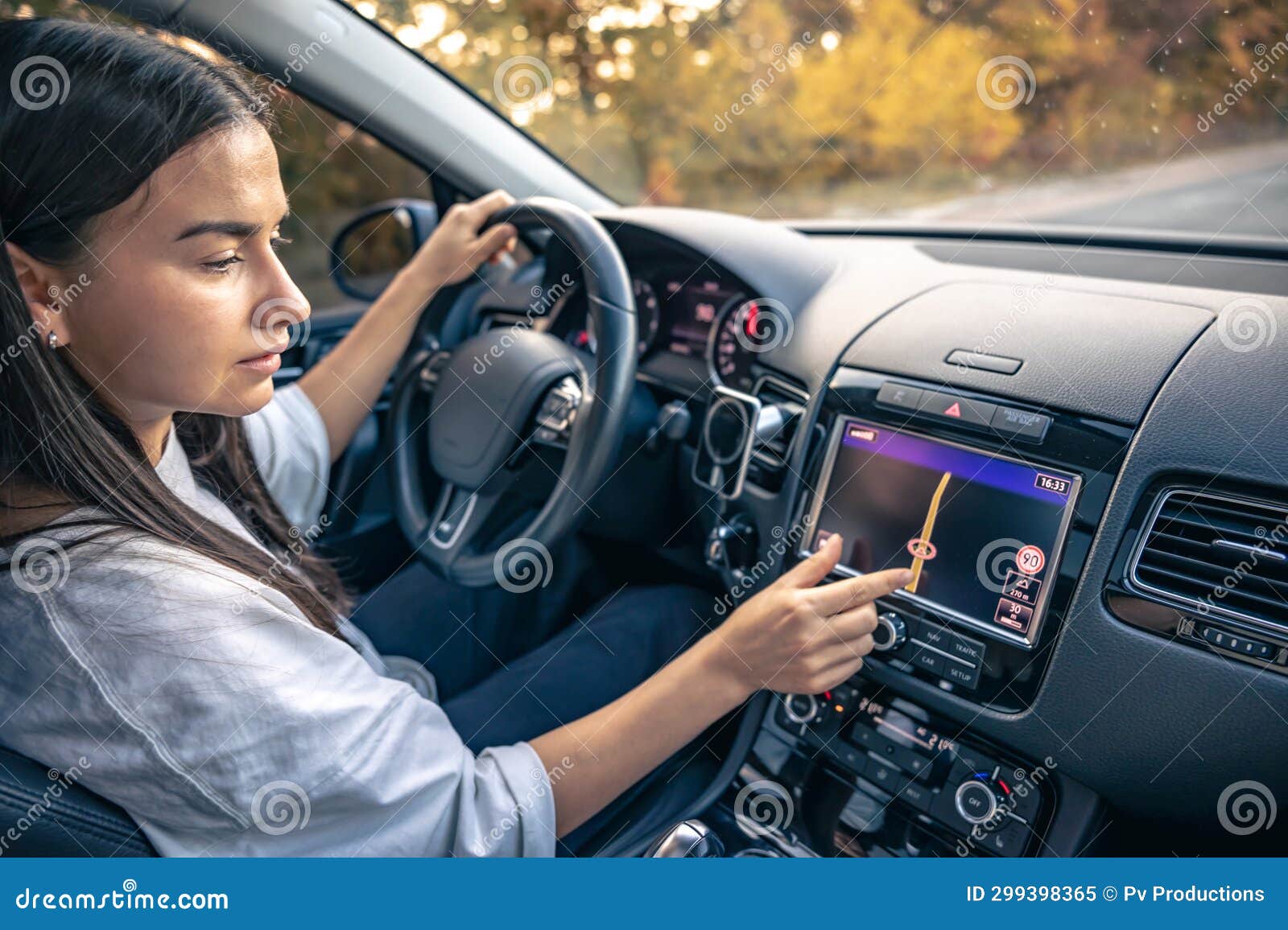 Woman Using Navigation System while Driving a Car. Stock Image - Image ... Woman Using Navigation System while Driving a Car. Stock Image - Image ...