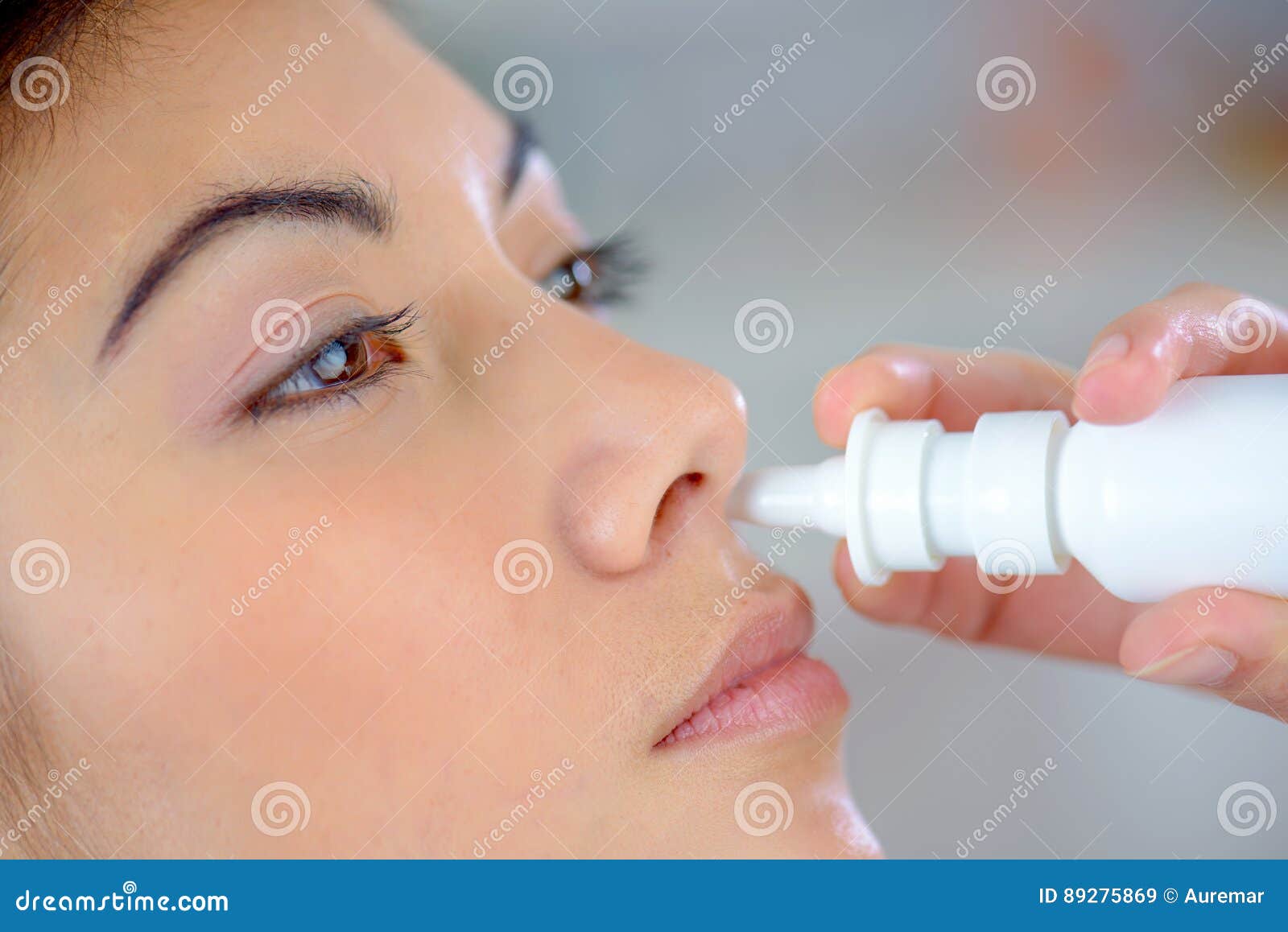 Woman using nose spray stock image. Image of healthcare - 89275869