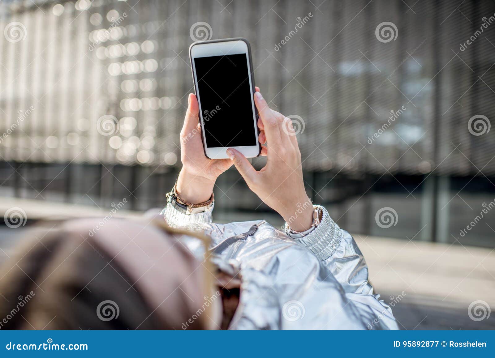 Woman using phone outdoors stock image. Image of beautiful - 95892877