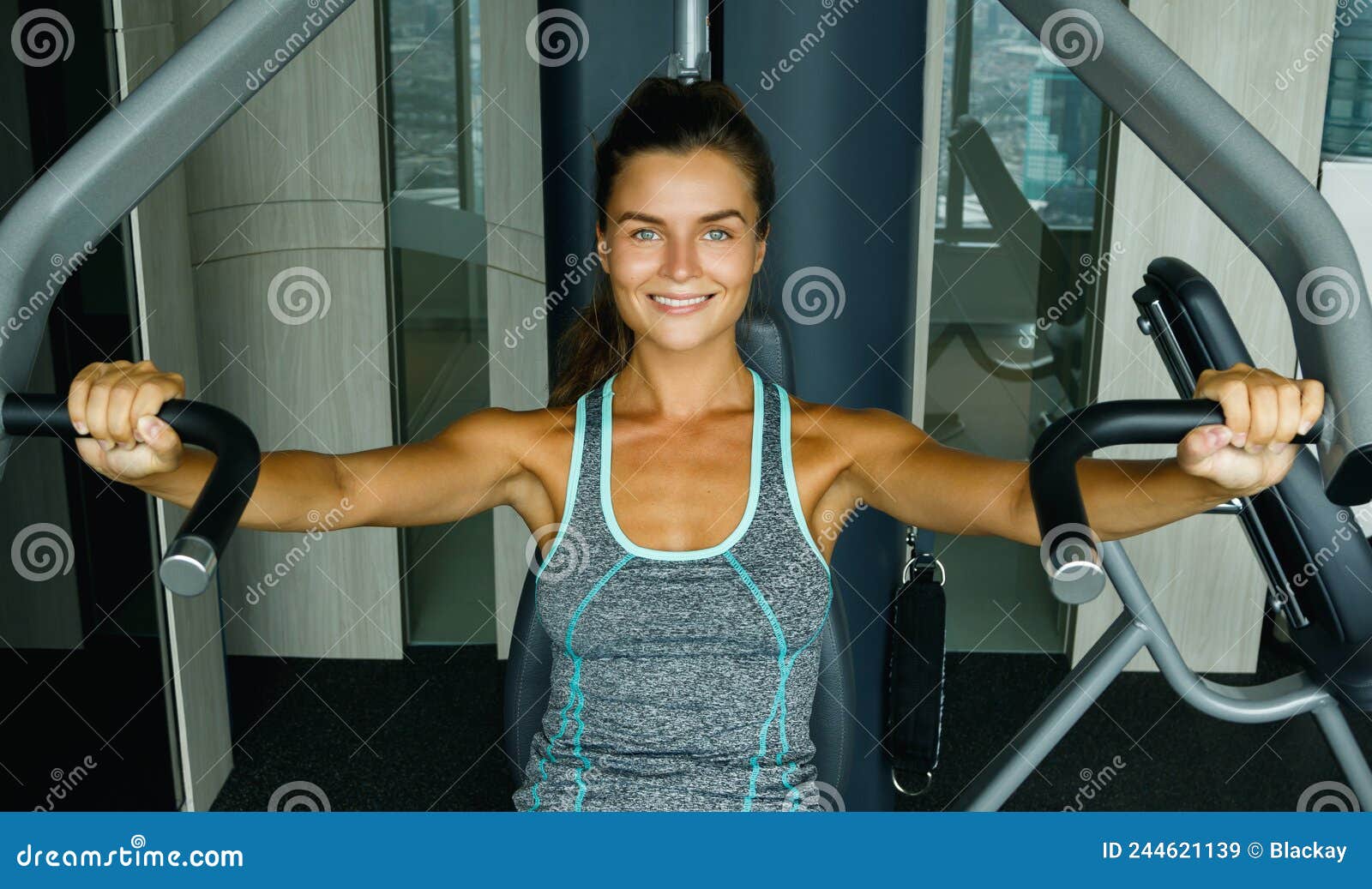 Woman Using Press Machine in the Gym Stock Image - Image of personal ...