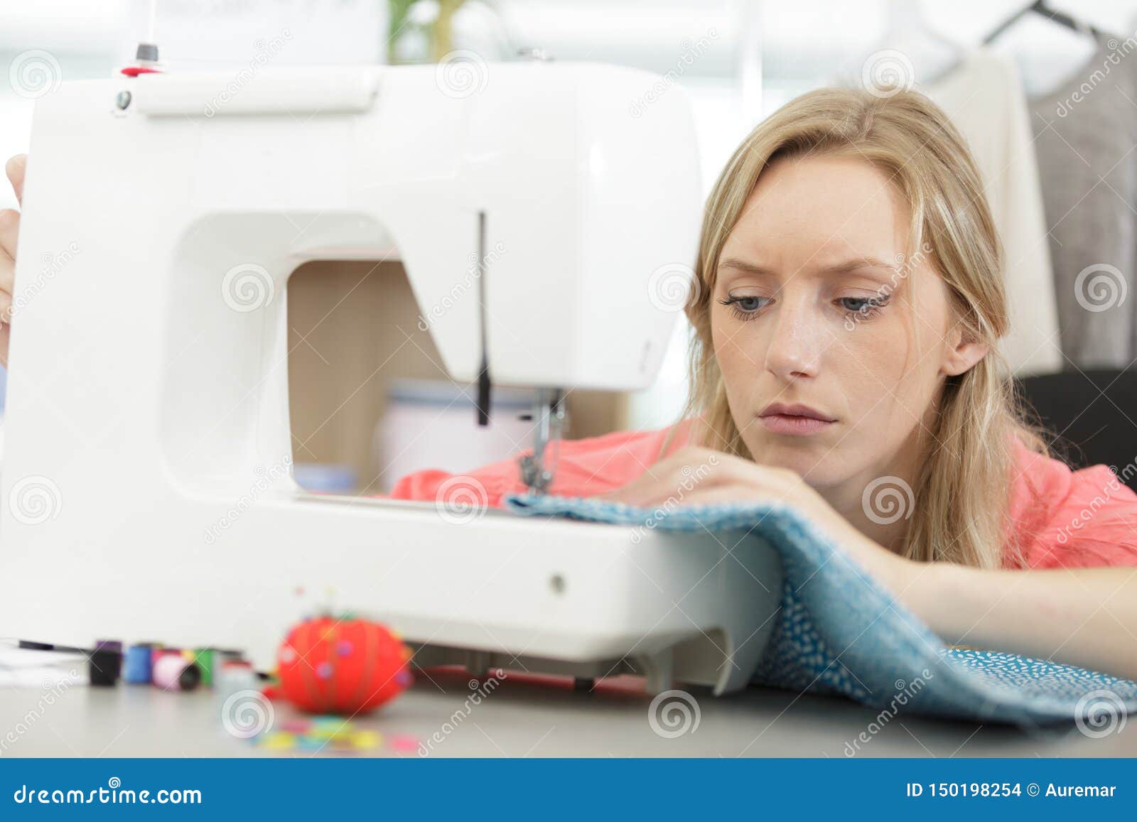 Woman using sewing machine stock photo. Image of tailoring - 150198254