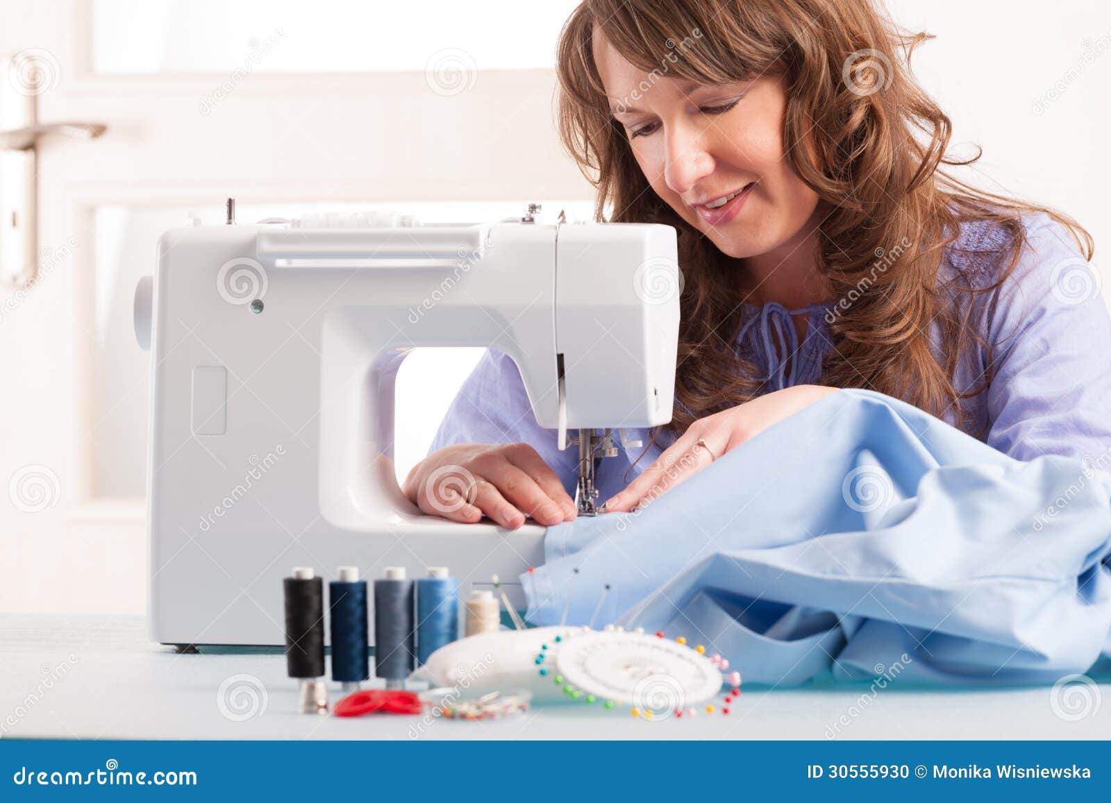 Woman using sewing machine stock photo. Image of people - 30555930