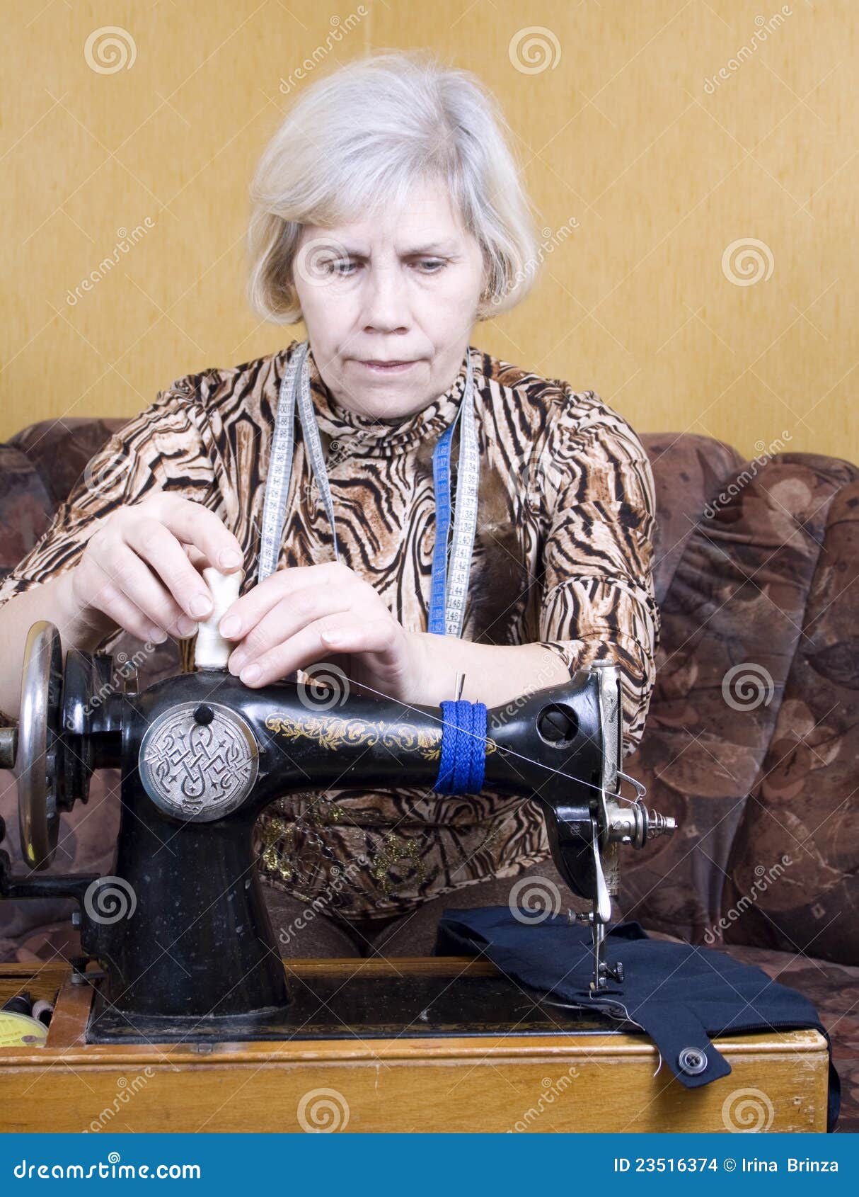 Woman Using Sewing Machine at Home Stock Photo - Image of sewing, hobby ...