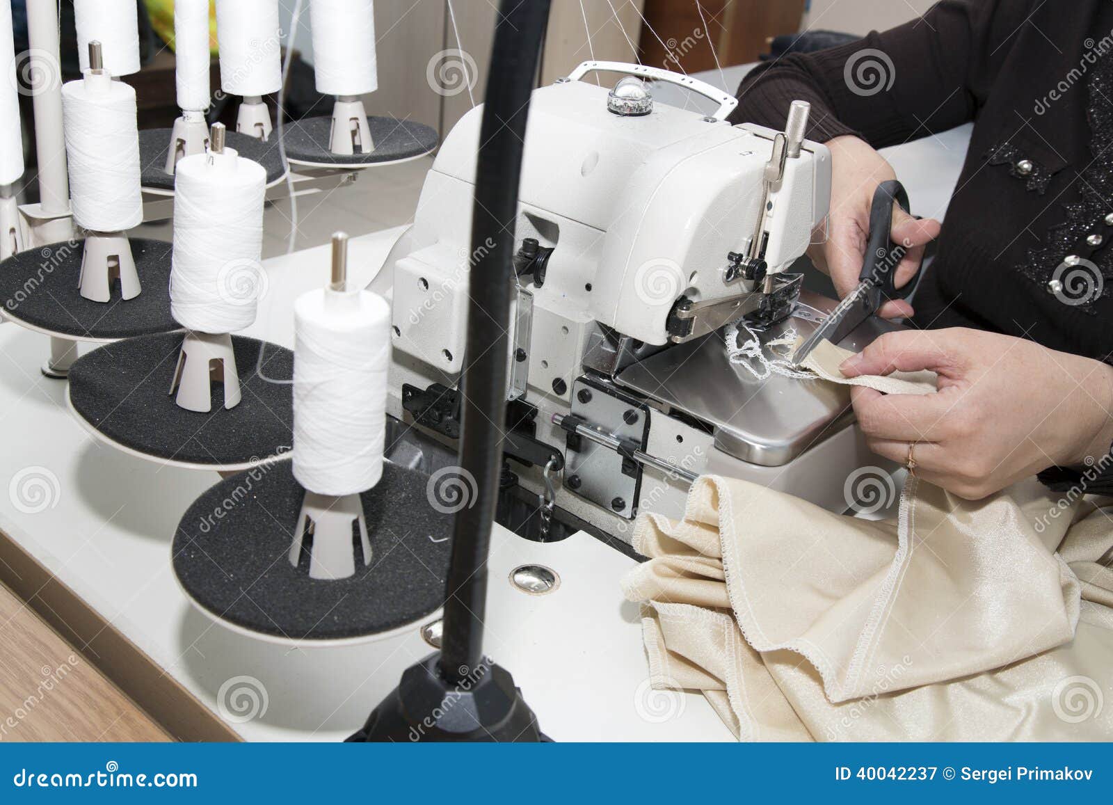 Woman using sewing machine stock image. Image of sewing - 40042237