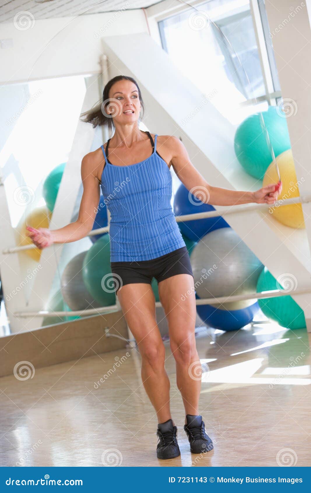 Woman Using Skipping Rope at Gym Stock Image - Image of indoors, effort ...