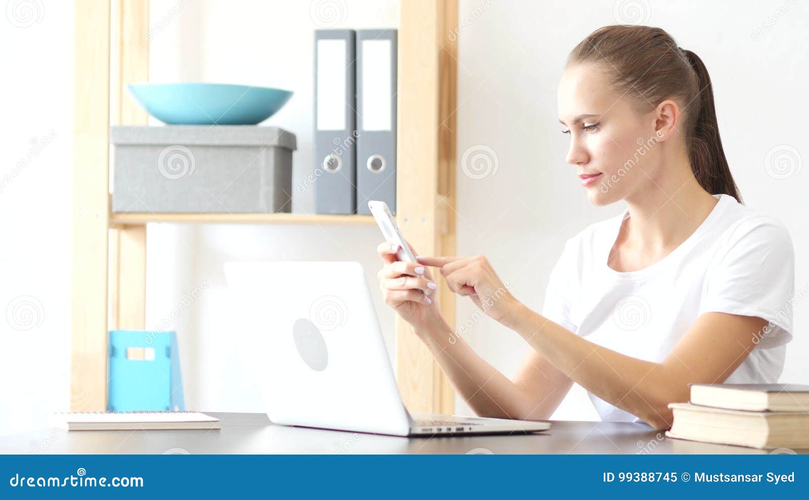 Woman Using Smartphone Applications at Work in Office Stock Image ...