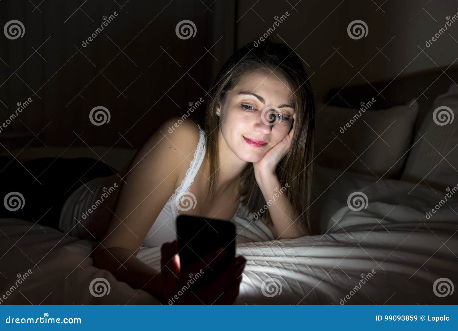 Woman Using Smartphone on Bed at Night Stock Image - Image of hold ...