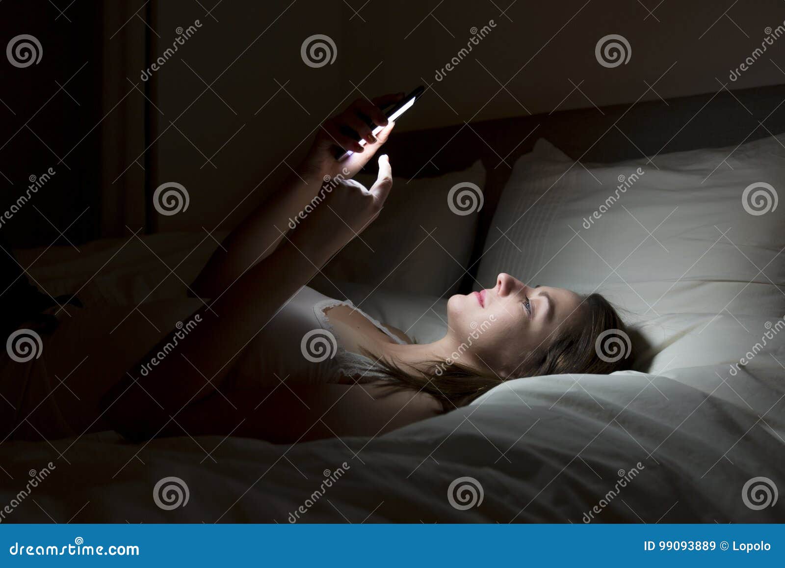 Woman Using Smartphone on Bed at Night Stock Image - Image of relax ...