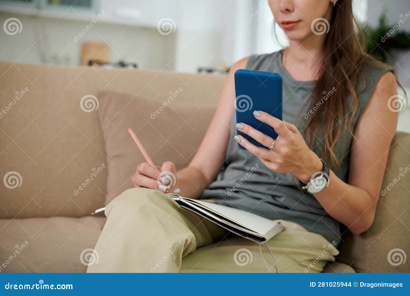 Woman Using Smartphone and Making Notes Stock Photo - Image of modern ...