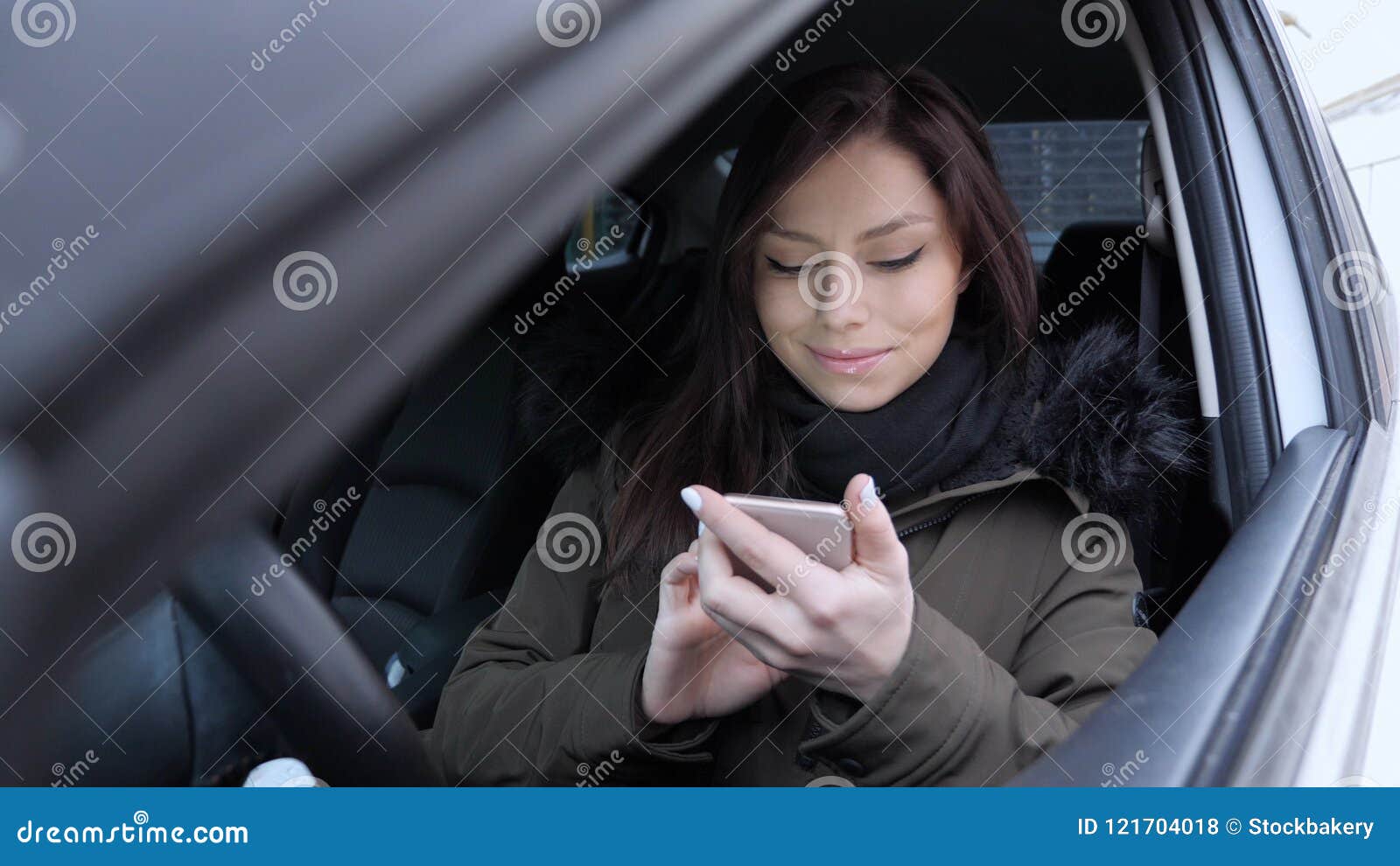Woman Using Smartphone, Texting Message while Sitting in Car Stock ... Woman Using Smartphone, Texting Message while Sitting in Car Stock ...