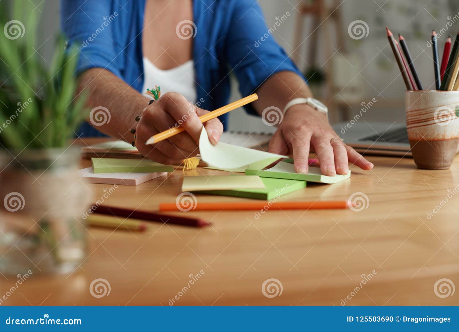 Woman using sticky notes stock photo. Image of planning - 125503690