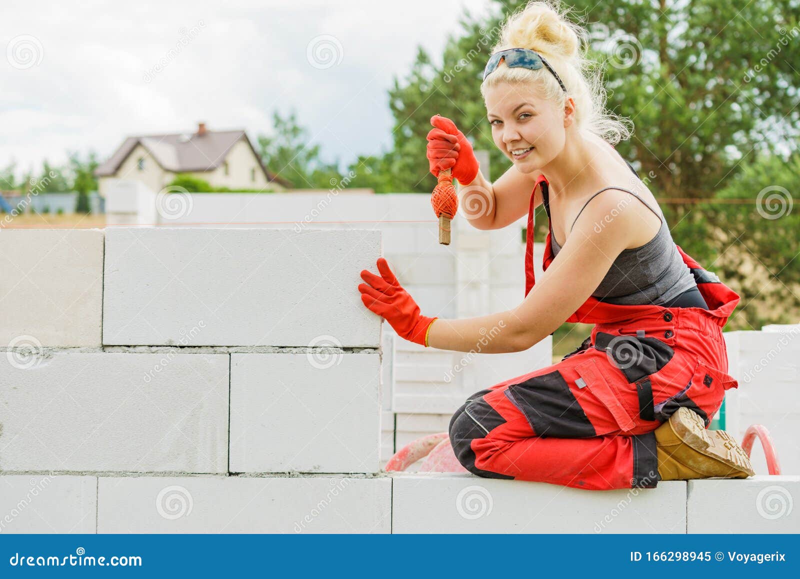 Woman Using String As Level in Wall Construction Stock Image - Image of ...