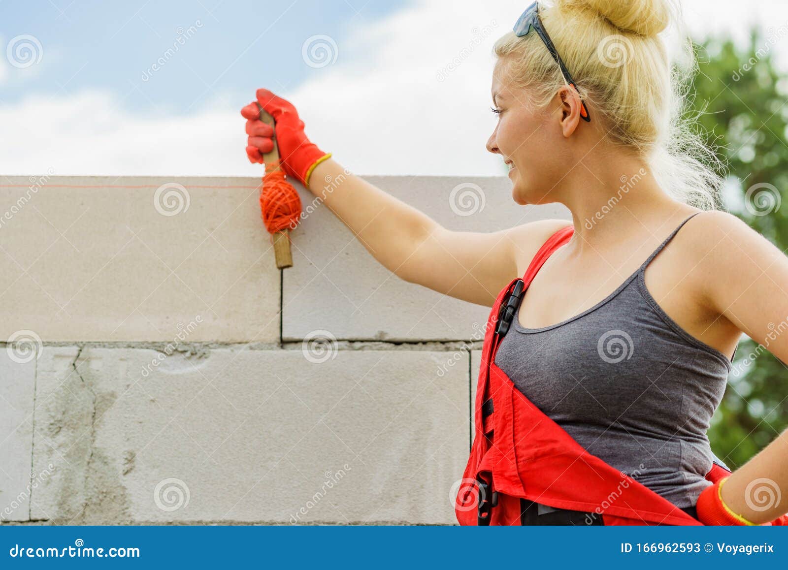 Woman Using String As Level in Wall Construction Stock Image - Image of ...