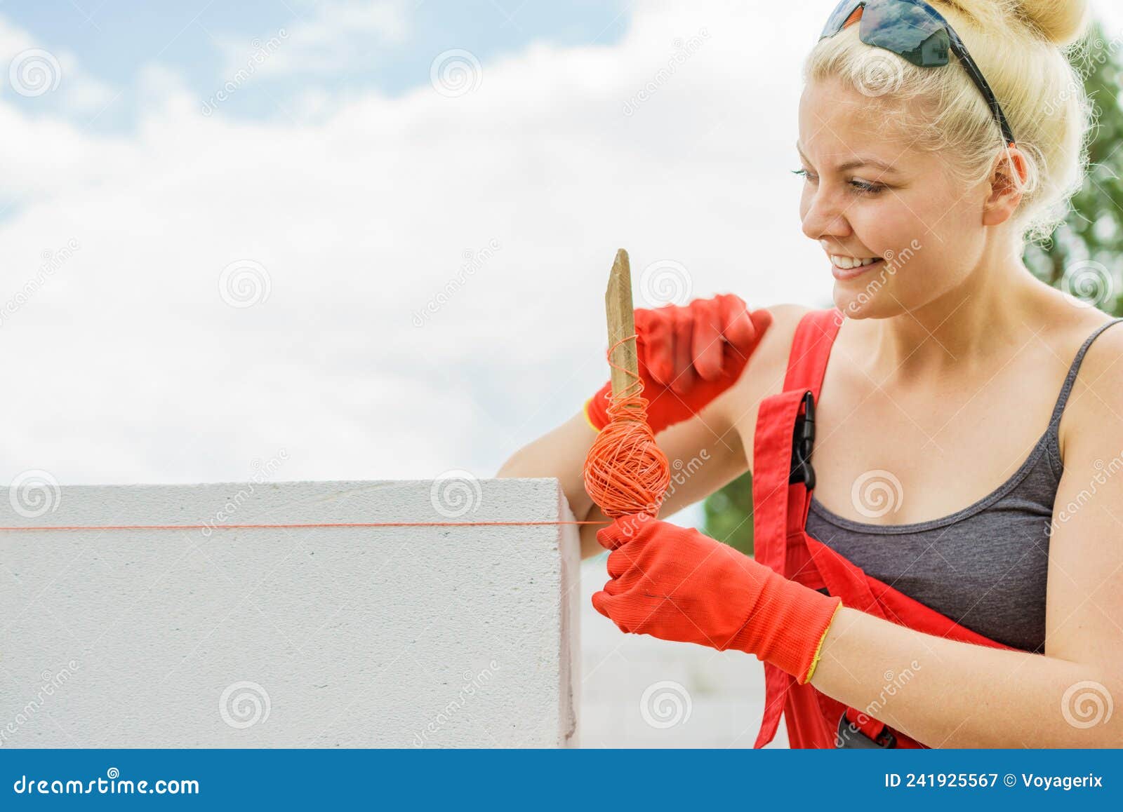 Woman Using String As Level in Wall Construction Stock Image - Image of ...