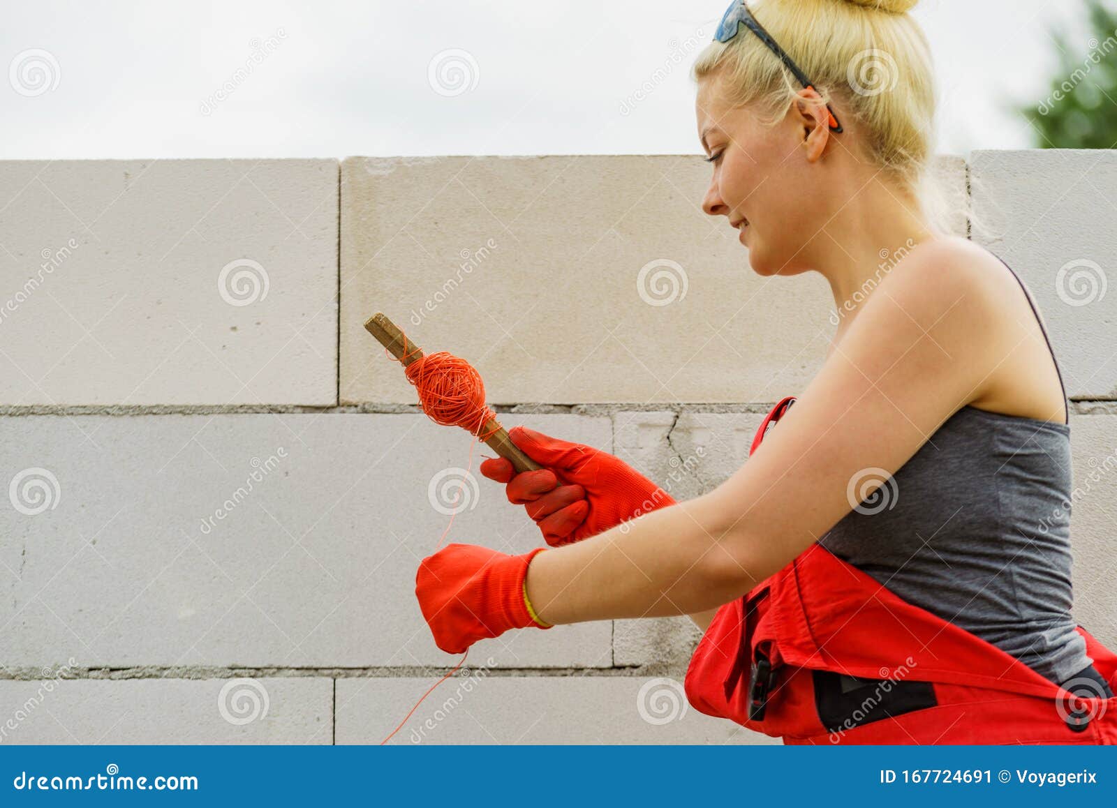 Woman Using String As Level in Wall Construction Stock Image - Image of ...