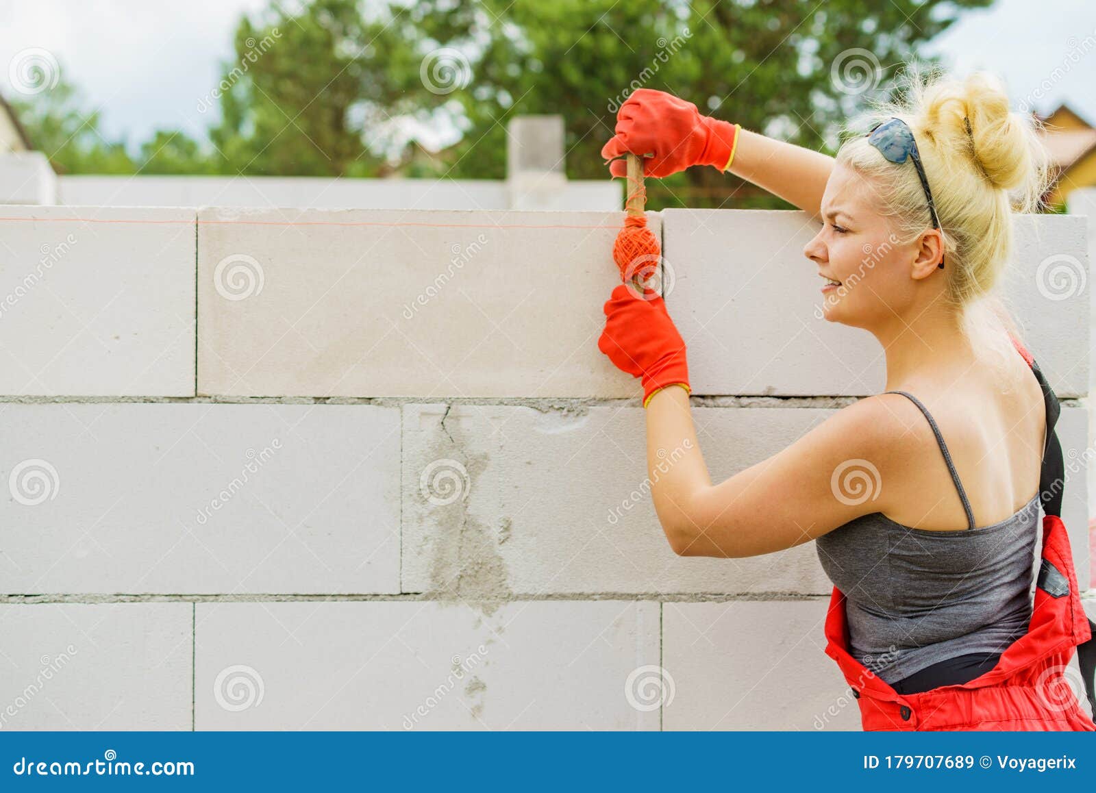 Woman Using String As Level in Wall Construction Stock Image - Image of ...