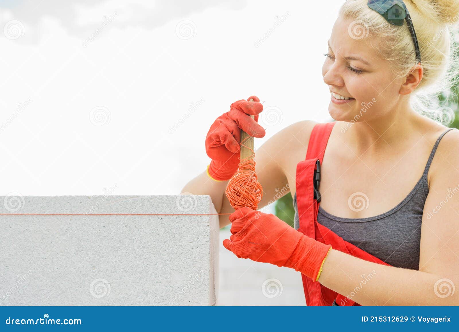 Woman Using String As Level in Wall Construction Stock Image - Image of ...