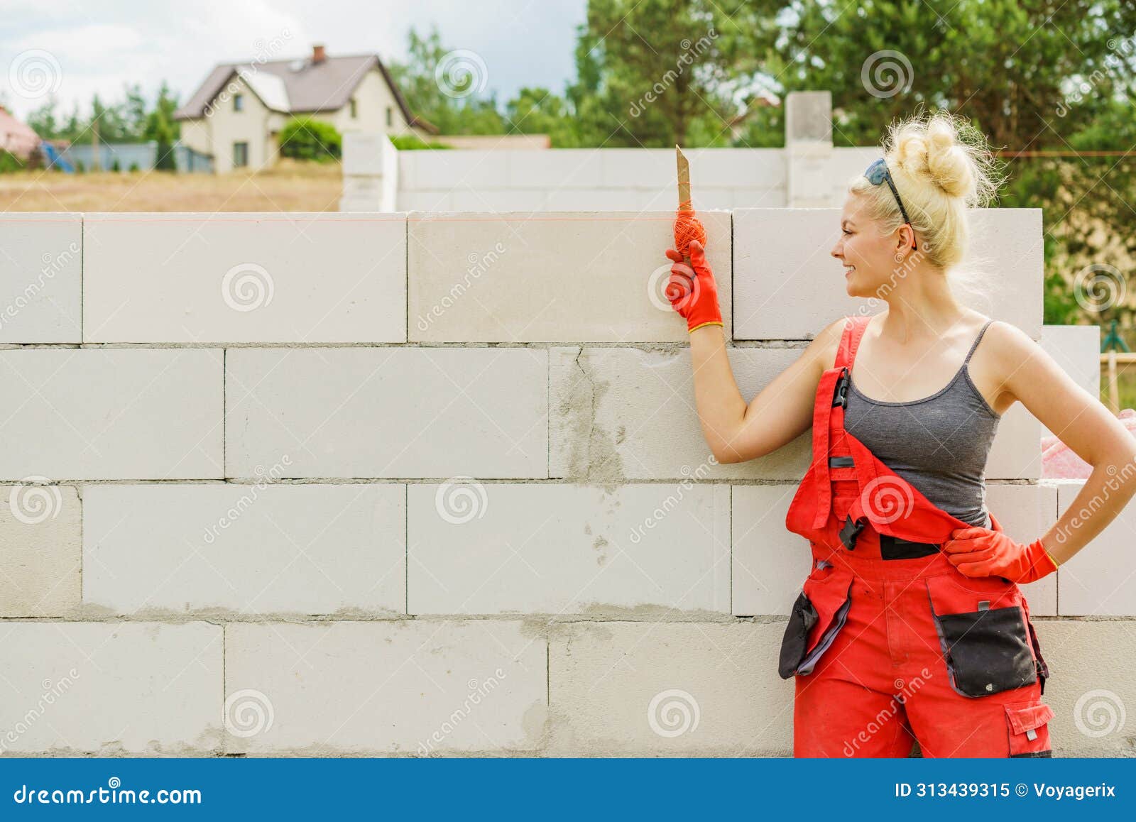 Woman Using String As Level in Wall Construction Stock Image - Image of ...