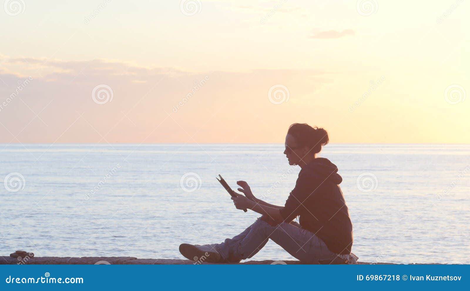 Woman Using a Tablet on the Beach during Sunset Stock Footage - Video ...