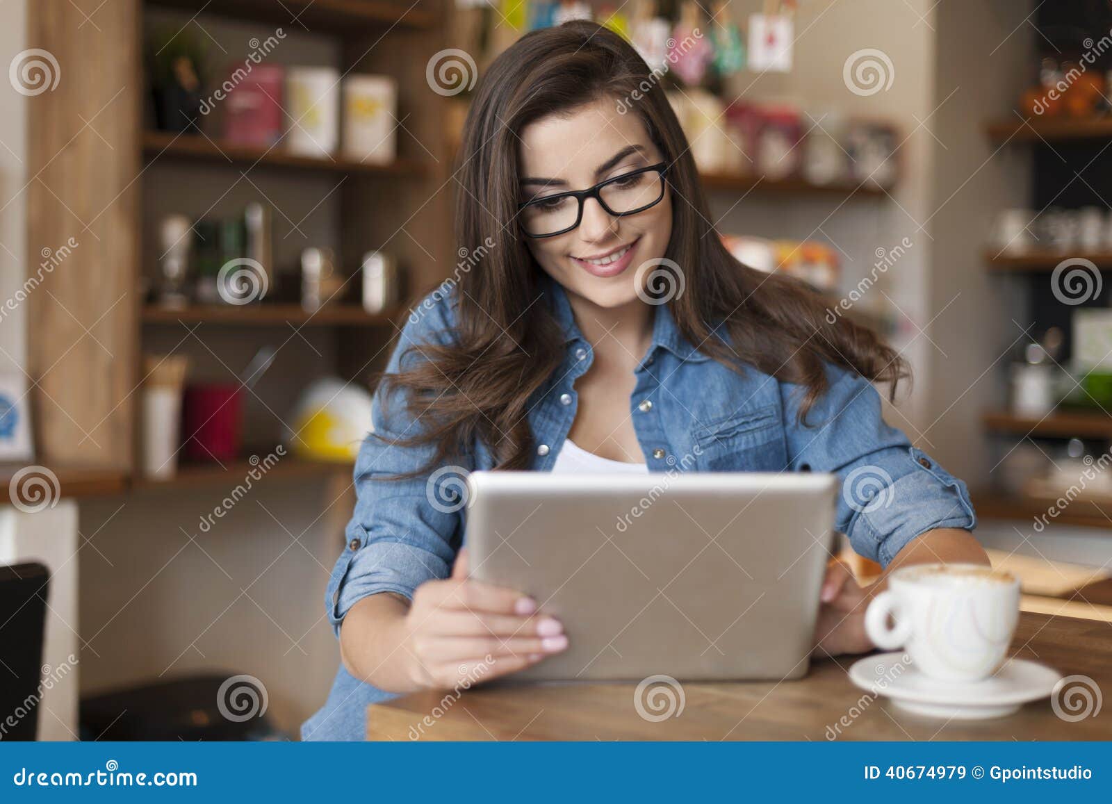 Woman using tablet in cafe stock image. Image of street - 40674979