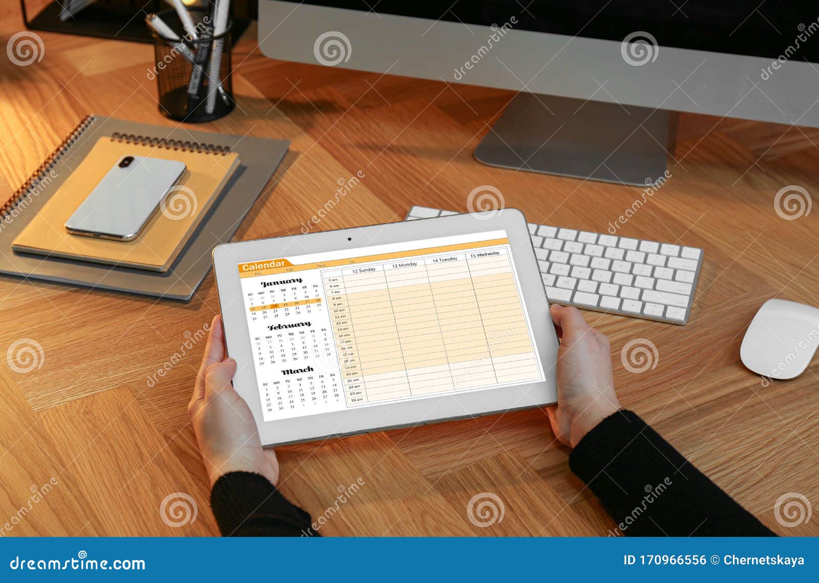 Woman Using Tablet with Calendar App at Workplace Stock Photo - Image ...