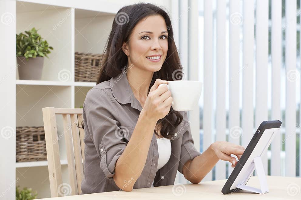 Woman Using Tablet Computer Drinking Tea Coffee Stock Image - Image of ...