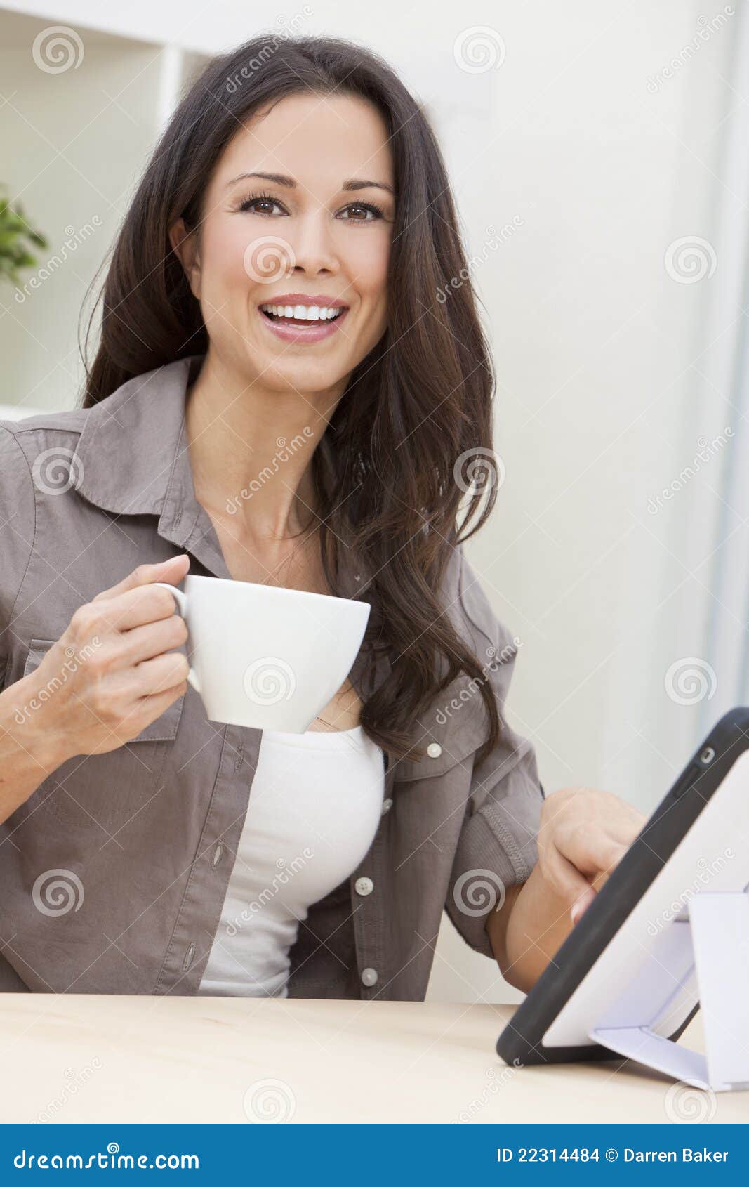 Woman Using Tablet Computer Drinking Tea or Coffee Stock Photo - Image ...