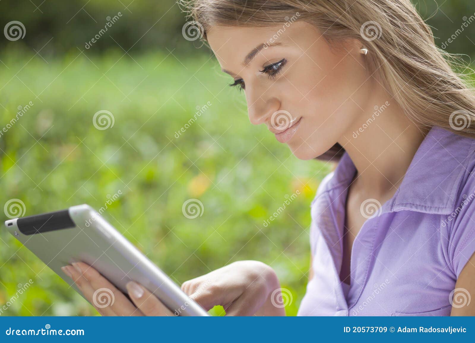 Woman Using Tablet Computer in Park Stock Image - Image of focus ...