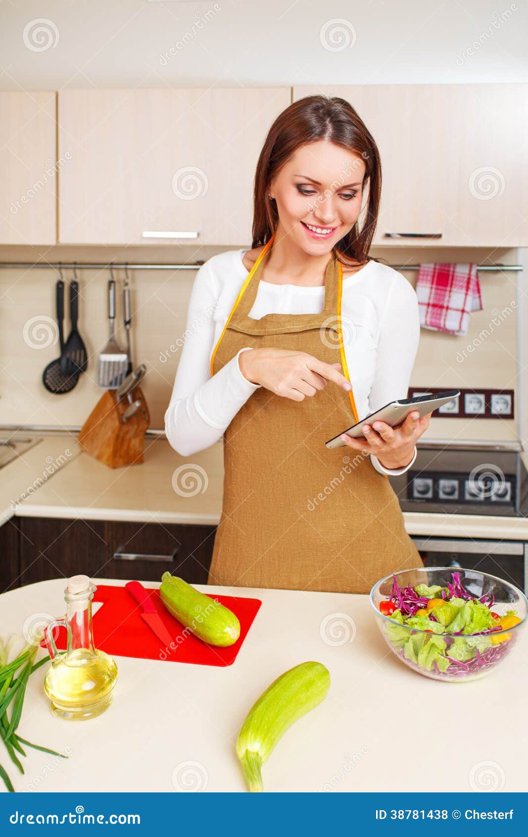 Woman Using a Tablet Computer To Cook Stock Photo - Image of reading ...