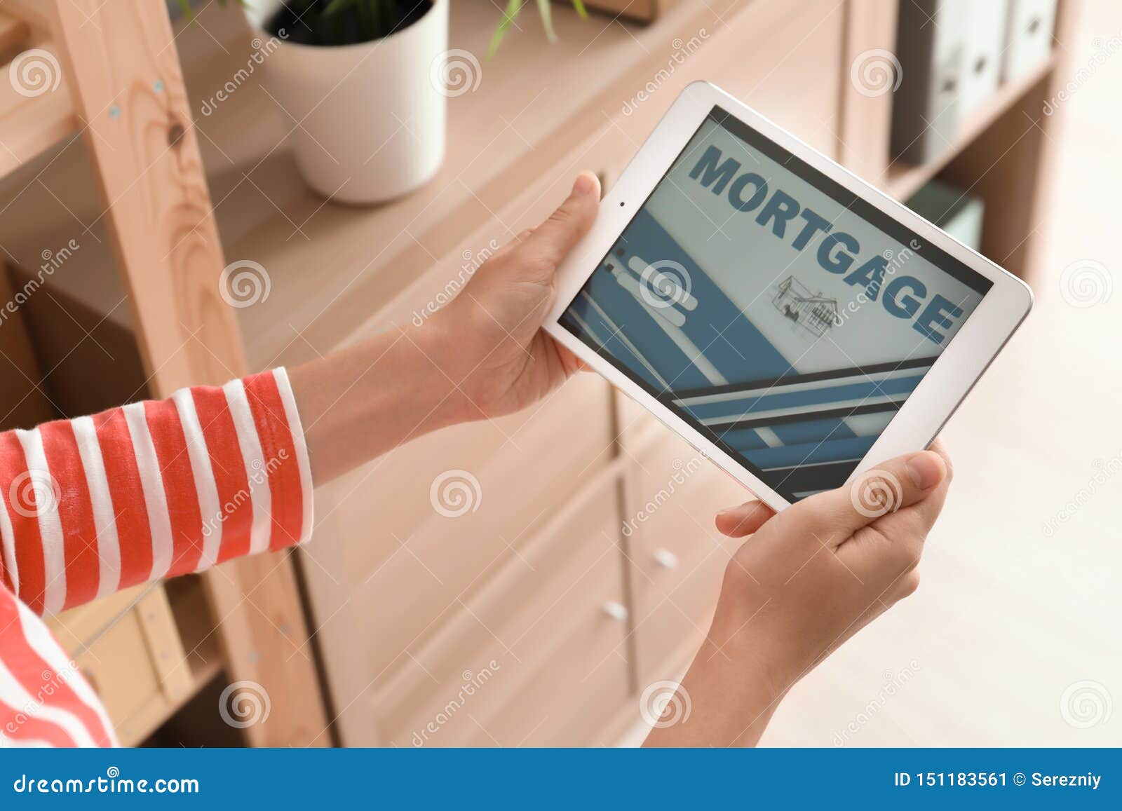 Woman Using Tablet Computer To Pay Mortgage Loan Online at Home ... Woman Using Tablet Computer To Pay Mortgage Loan Online at Home ...