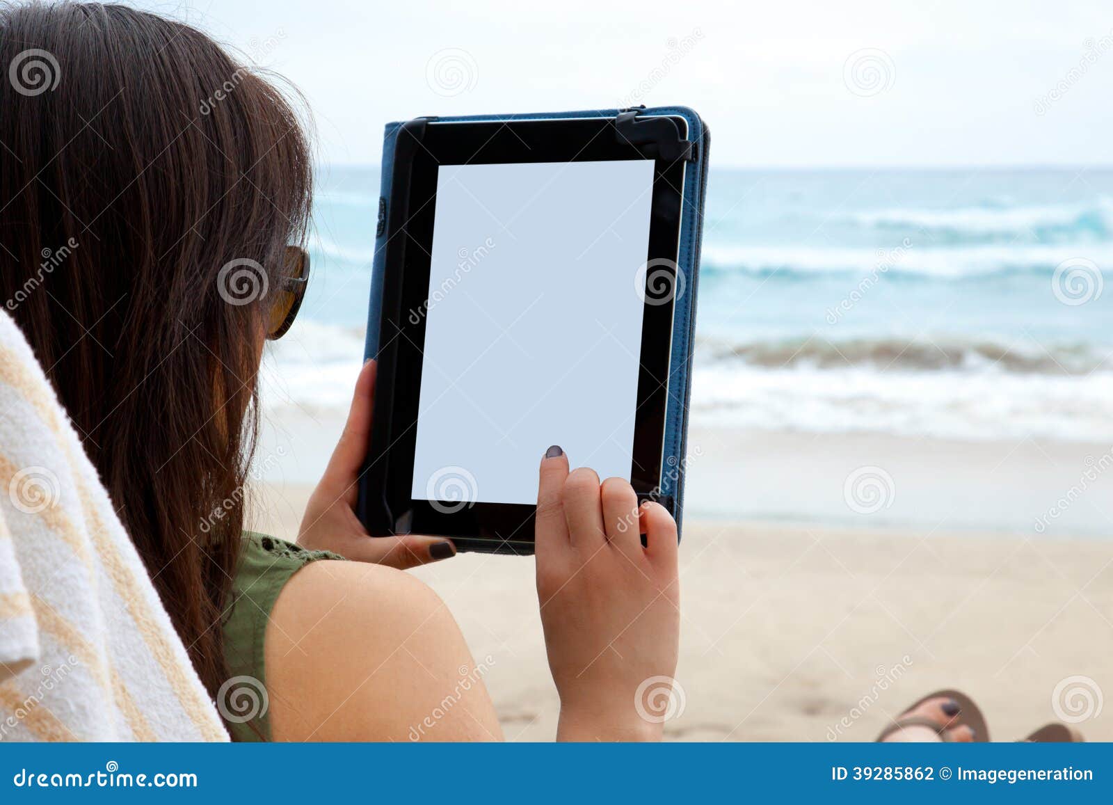 Woman Using Tablet Device while on a Beach Stock Photo - Image of ...